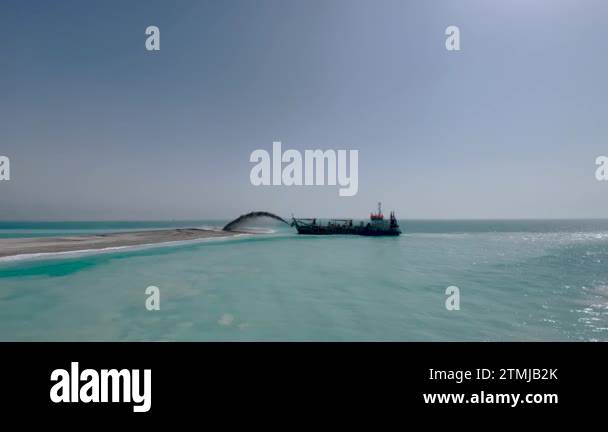 Construction ship creates a new island. Construction of artificial ...