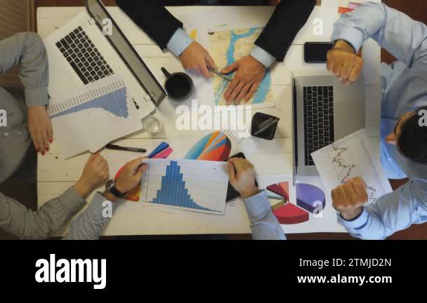 Male and female hands of colleagues putting their arms in centre and ...
