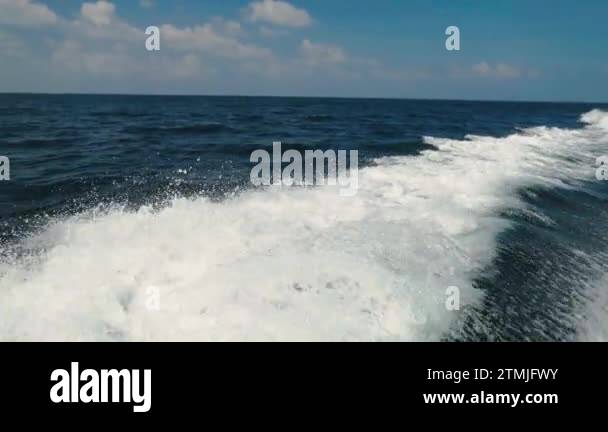 Ship's wake. The view from the boat is moving. A wide wake from a boat ...