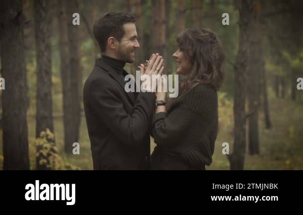 Beautiful nature. Lovers in the woods. Newly newlyweds take off their ...