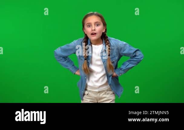 Disapproving shocked teen girl gesturing fist up and smiling standing ...