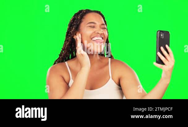 Woman, funny selfie and green screen for skincare and self care dermatology. Happy female model ...