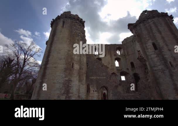 Nunney Castle and moat in the village of Nunney. Built in the 1370s by ...