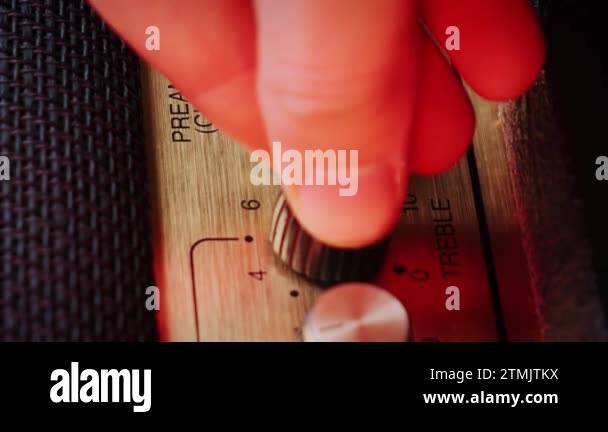 Guitar amplifier tone equalizer knobs. Vertical video. Hand tuning ...