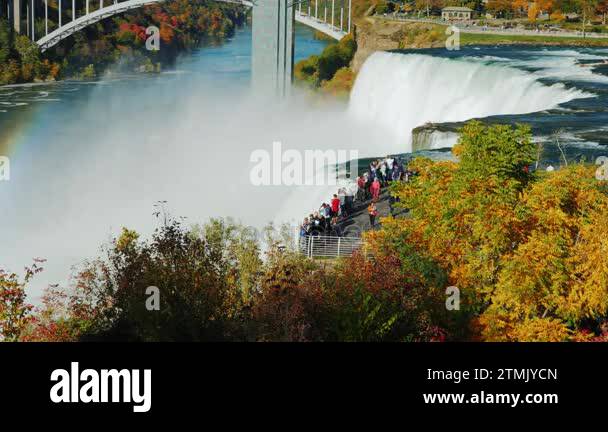 The observation deck near the famous Niagara Falls. Tourists admire the ...