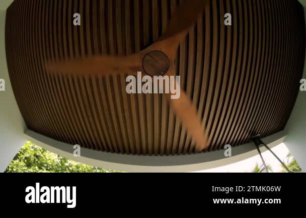 Ceiling fan on wooden roof electric ceiling fan rotating slowly and air ...