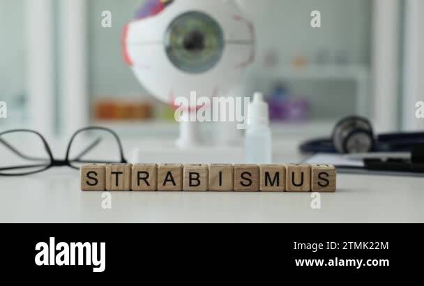 Strabismus heterotropia word and symptom of asymmetrical position of ...