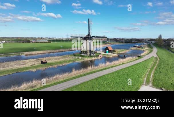 Witness the graceful rotation of the windmill blades as they harness ...