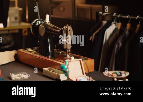 Fashion atelier sewing machine and tools on workshop table, luxury ...