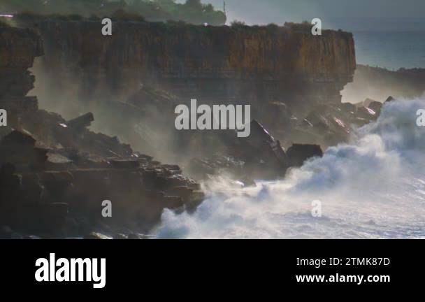 Powerful waves breaking cliffs making explosion splashing in super slow ...