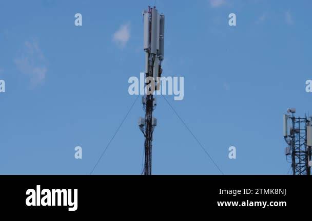 Technician engineer is repairing a mobile communication tower ...