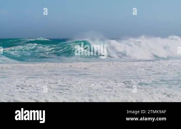 Rush of the stormy ocean, captivating footage of waves rolling onto ...