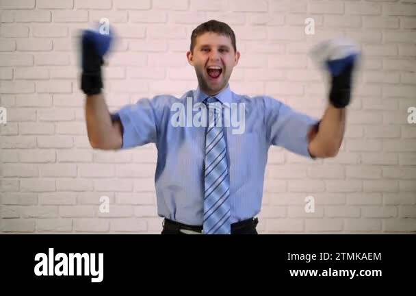 Businessman with boxing gloves celebrating the victory. Man in boxing ...
