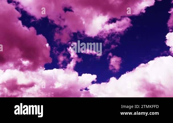 Puffy lilac pink clouds in a purple sky. Colorful sunset sky with ...