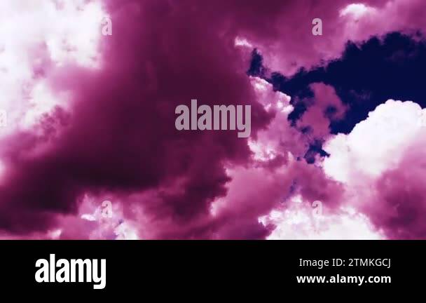 Puffy lilac pink clouds in a purple sky. Colorful sunset sky with ...
