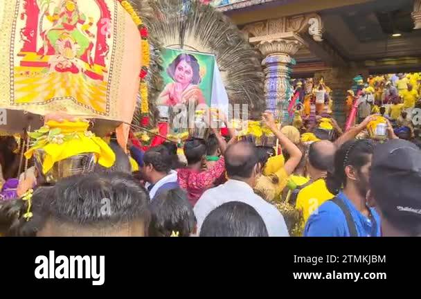 Hindu devotees with traditional appearance outside Murugan temple ...