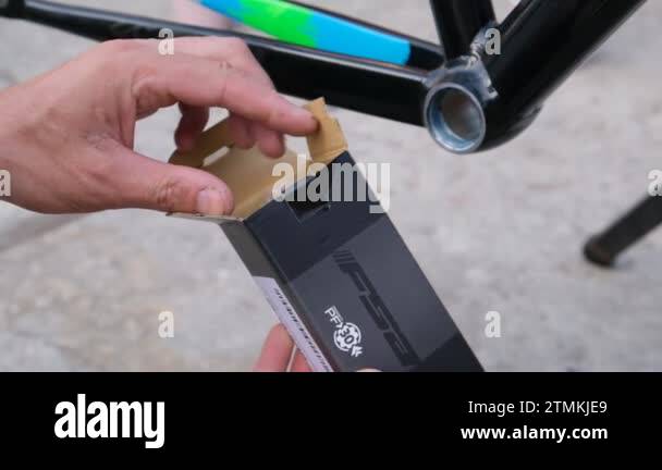 May 17, 2023Ukraine, Dnipro.Assembly master led at work. Replacing the system on a track bike ...