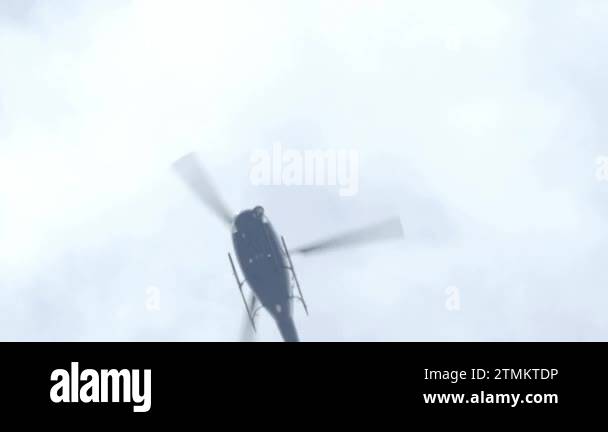 Helicopter flying in the sky low angle shot footage. Helicopter in ...