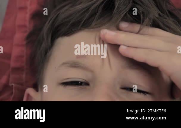 Portrait of a sad boy with a scratch and bump on his forehead Stock ...