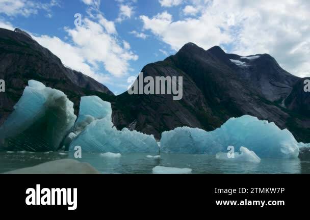 Watch the ice floes and icebergs on the river in a small boat. Rocks ...