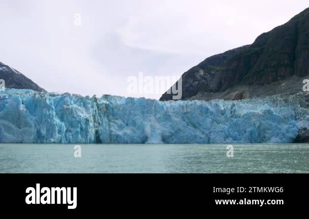 Spectacular glacier calving. Ice cubes fell into the water like an ...