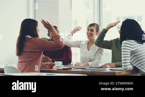 High five, motivation and laughing with a business team celebrating ...