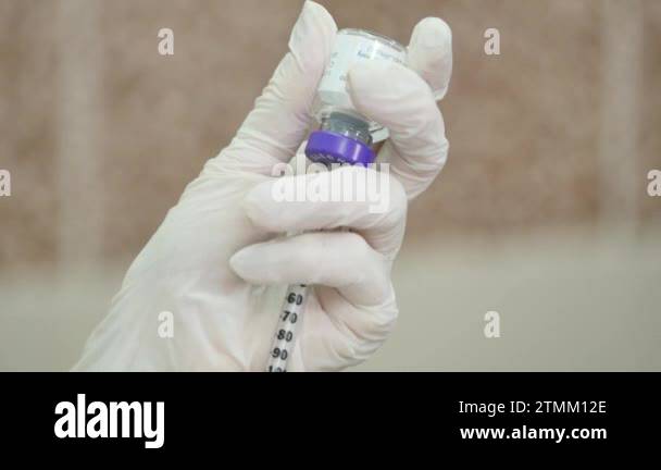 Medical doctor or nurse loading syringe for injection Stock Video ...