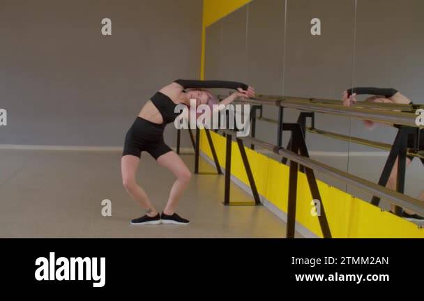 Graceful stylish sporty fit attractive female dancer standing at first ...