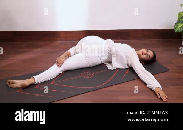 Video of woman performing Reclined Spinal Twist (Supta Matsyendrasana ...