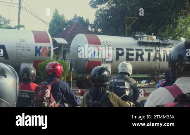 Malang, Indonesia -May 11, 2023 : Motorcyclists lining up at a train ...