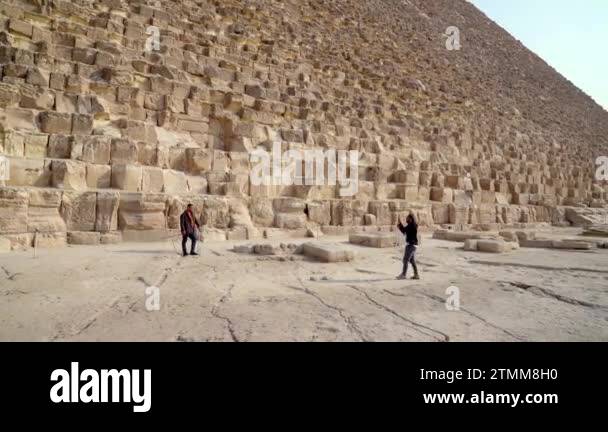 Giza, Egypt. December 2022. Two friends take pictures in front of the ...