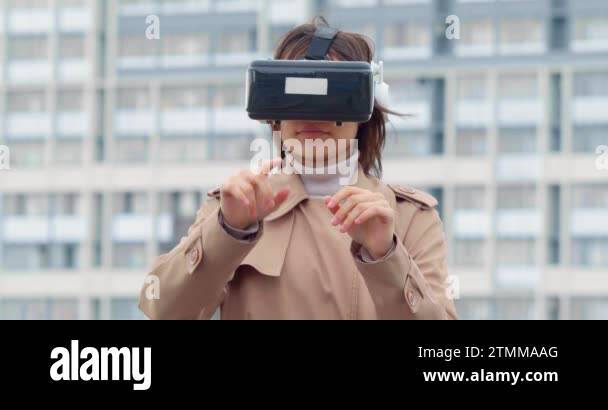 Learning and being present anywhere in the world with VR. A teenage girl in VR glasses against ...