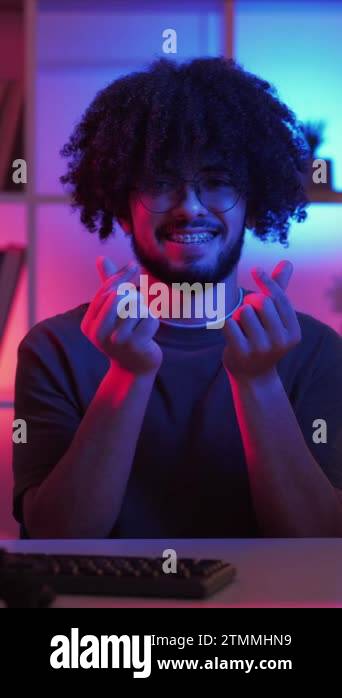 Vertical video. Small heart gesture. Positive man. Meme expression ...