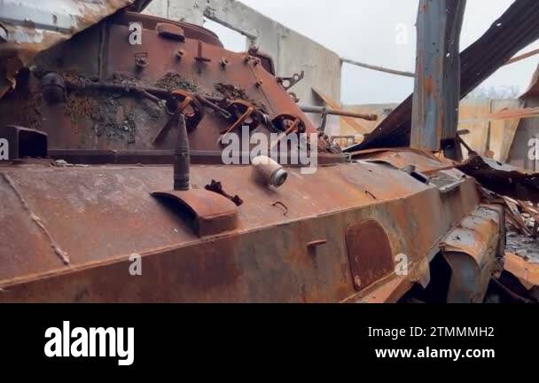 Rusty and broken Infantry fighting vehicle stands in a house destroyed ...