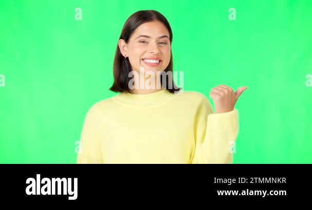 Portrait, pointing and green screen with an advertising woman in studio for marketing or product ...