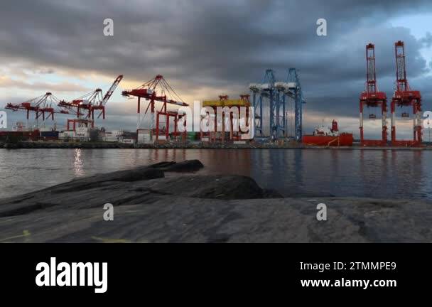 Working cargo ship yard on sunset. Global shipping container port ...