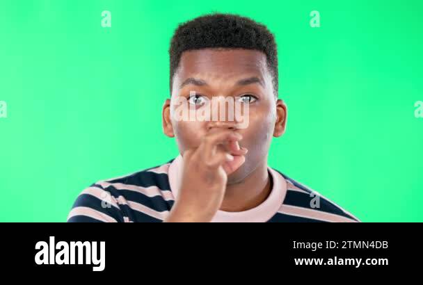 Portrait, secret and a black man on a green screen background in studio ...