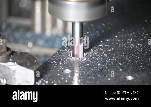 Close-up scene of counterbore cutting process on CNC milling machine ...