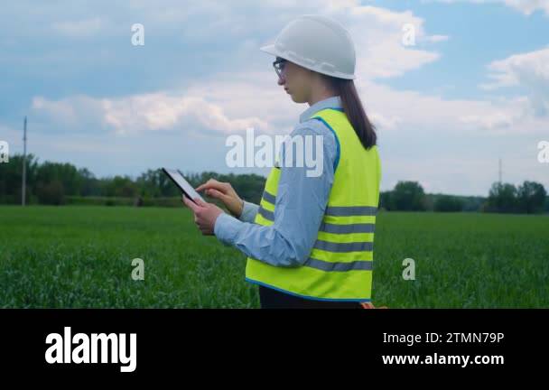 electrical engineer in a hard hat with a tablet. business technology ...