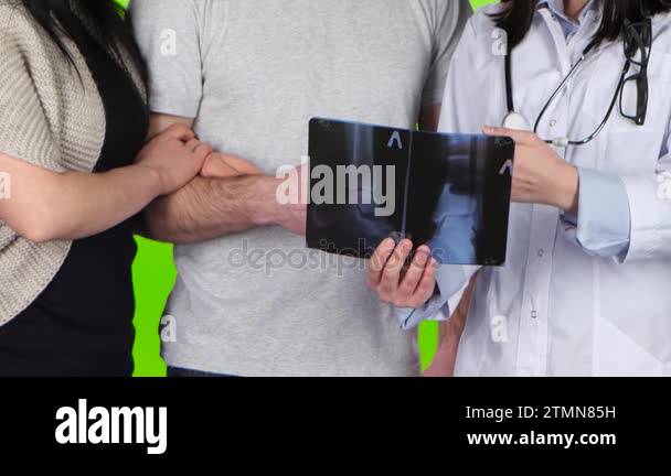 Doctor explains the x-ray picture and says goodbye to patient Stock ...