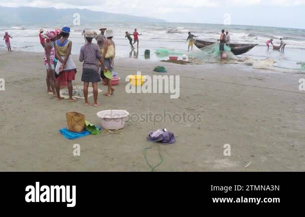 Native fishermen fishing on sea, using traditional technique pulling ...