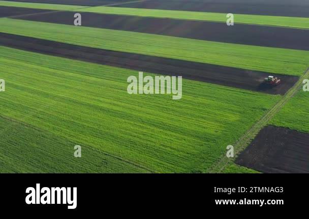 Above rotation view, orbit dolly move, of tractor as pulling mechanical ...