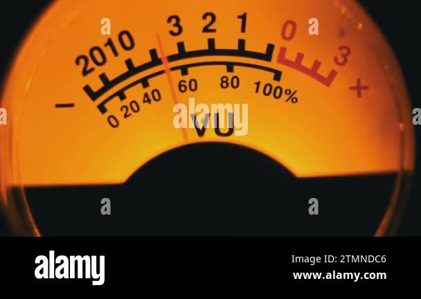 Analog dial indicator of audio signal level. Vintage arrow moves in ...