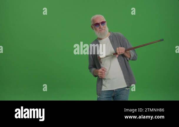 Green Screen. A Happy Old Man in the Funny Glasses Dancing with a Stick ...