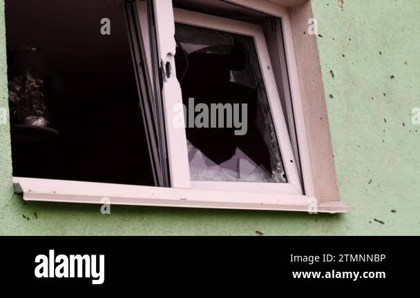 Destroyed and damaged window in the building as a result of the war. The houses were destroyed ...