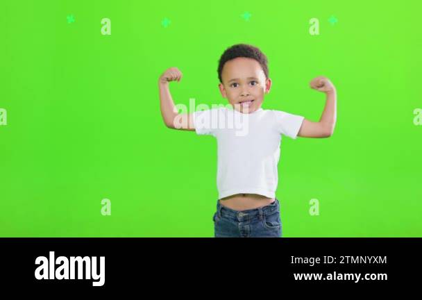 Little african american boy demonstrating strength, while raising arms ...