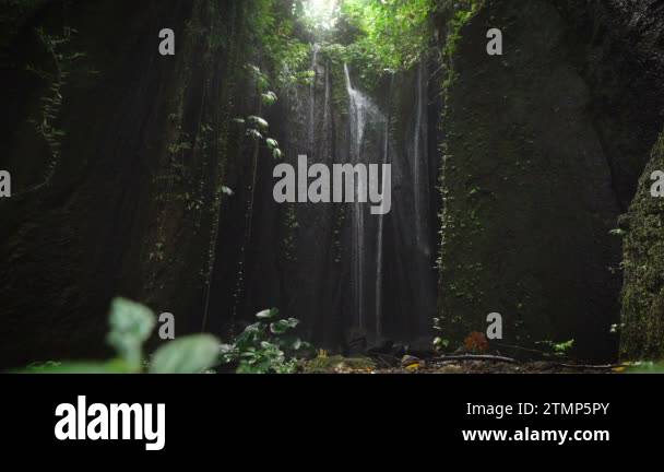 Mysterious waterfall, located in a hidden place of the eyes, lit by ...