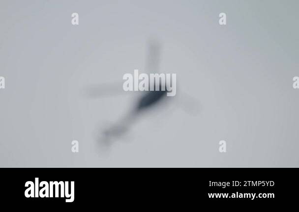 Helicopter flying in the sky low angle shot footage. Helicopter in ...