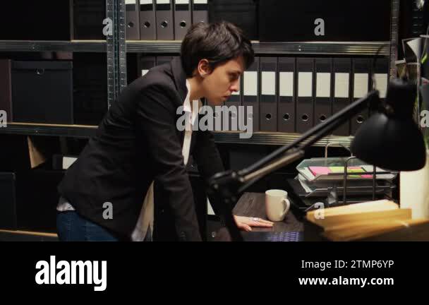 Detective conducting investigation using incriminating proof obtained ...