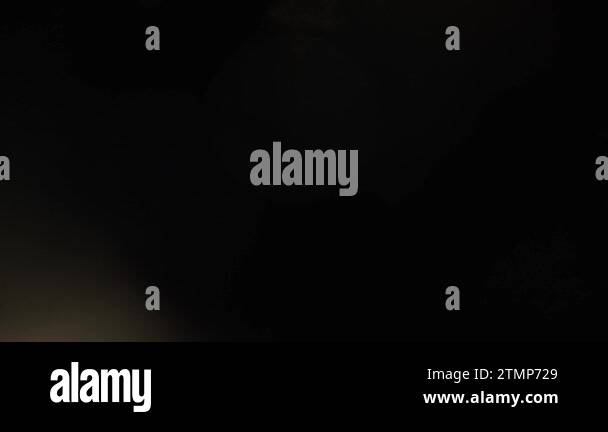 Bright light glow with rays and bokeh on the background of abstract ...